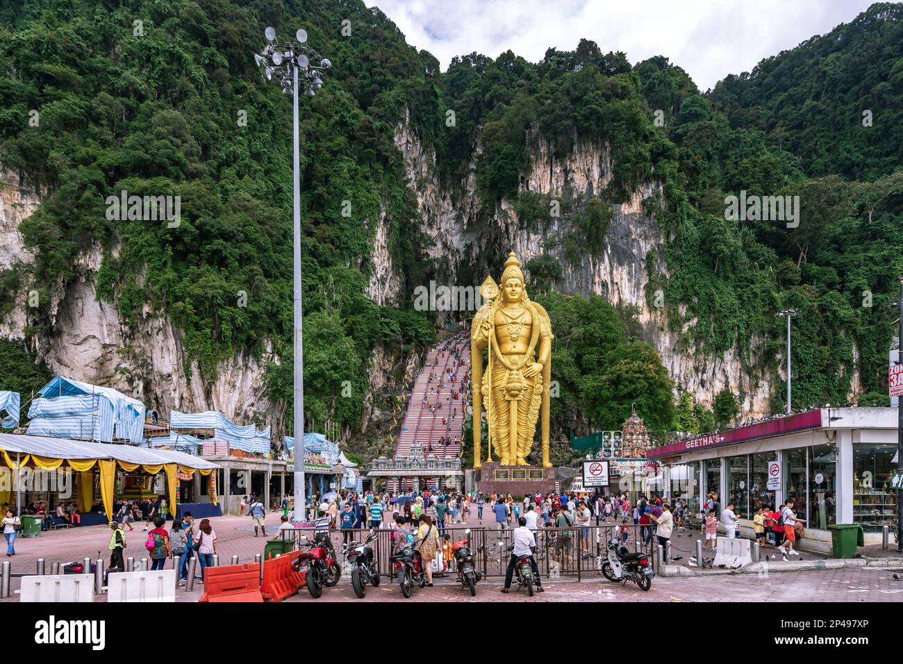 Selangor, Malaysia - Golden deity statue at the entrance to Batu Caves ...