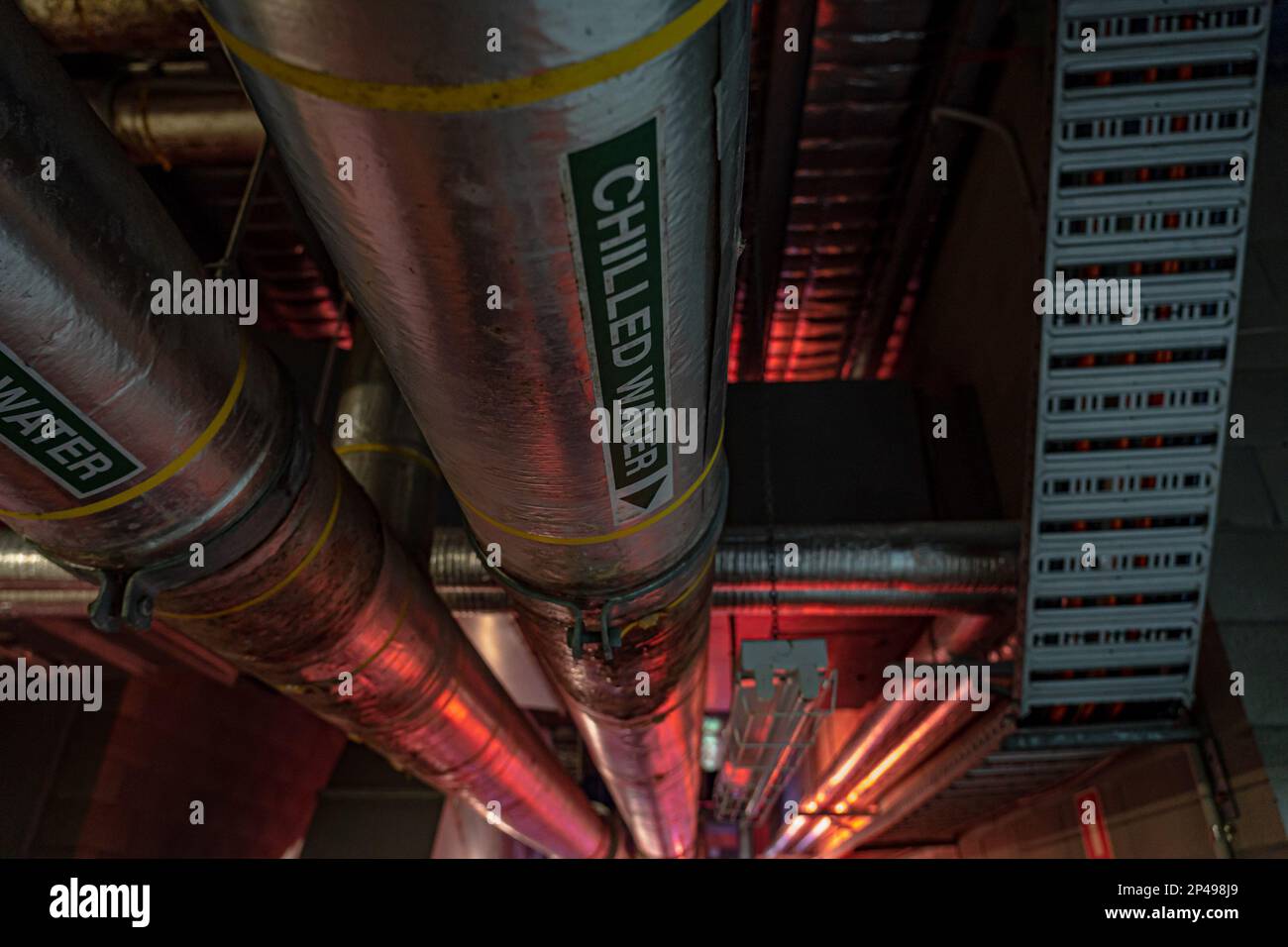 Service room with pipes running along the roof Stock Photo - Alamy