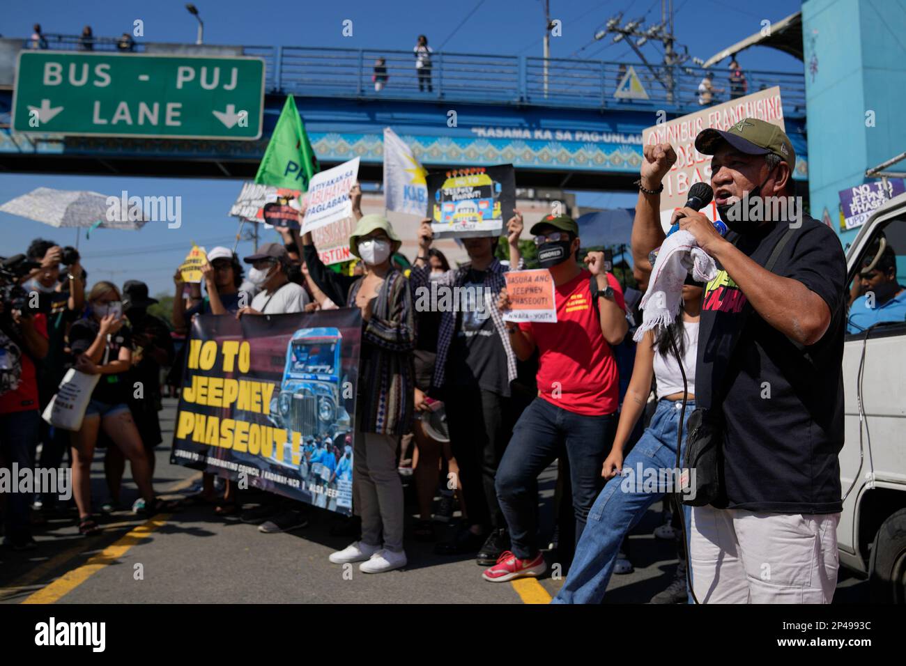 A jeepney driver shouts slogans during a transport strike in Quezon ...