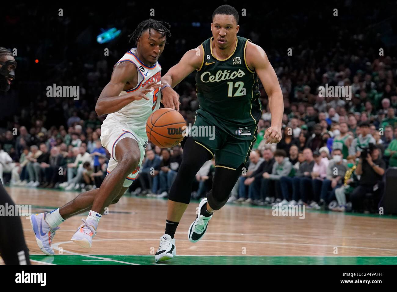 New York Knicks guard Immanuel Quickley drives toward the basket as ...