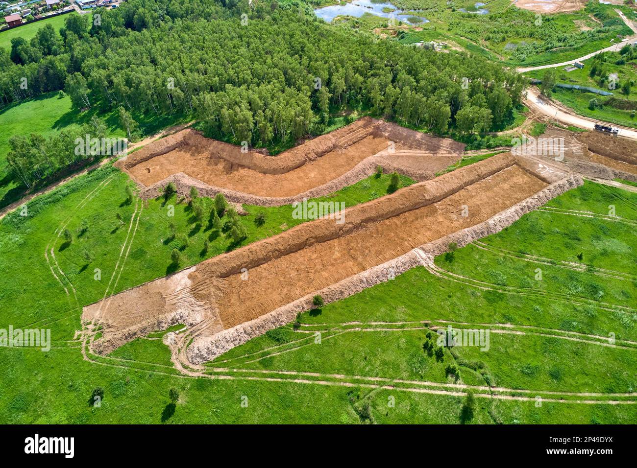 Removal of the top layer of earth overburden for the development of a ...