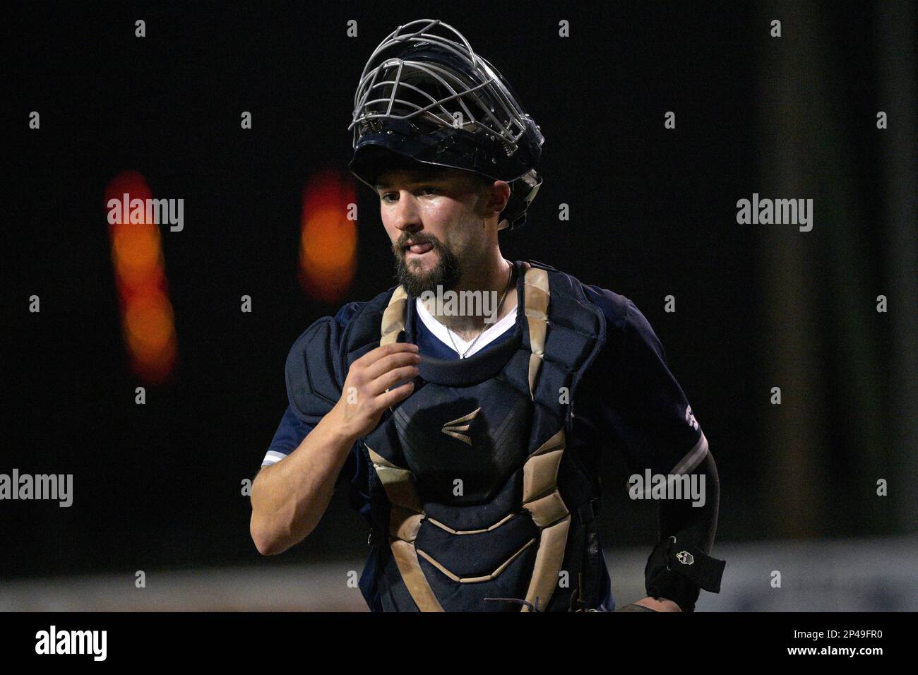 Longwood catcher Drayven Kowalski jogs back to home plate after a play ...