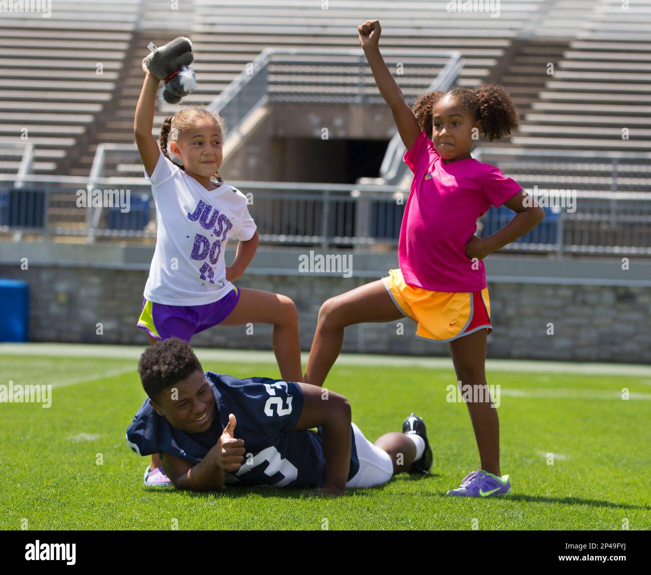 Penn State freshman running back Mark Allen is tackled by head coach ...