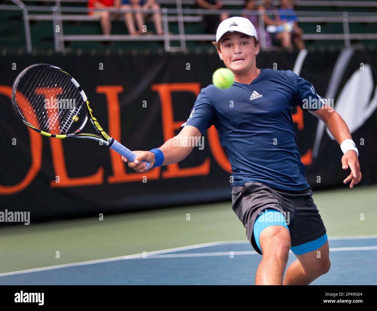 Connor Hance, from Torrance Calif., hits the ball back toward John ...