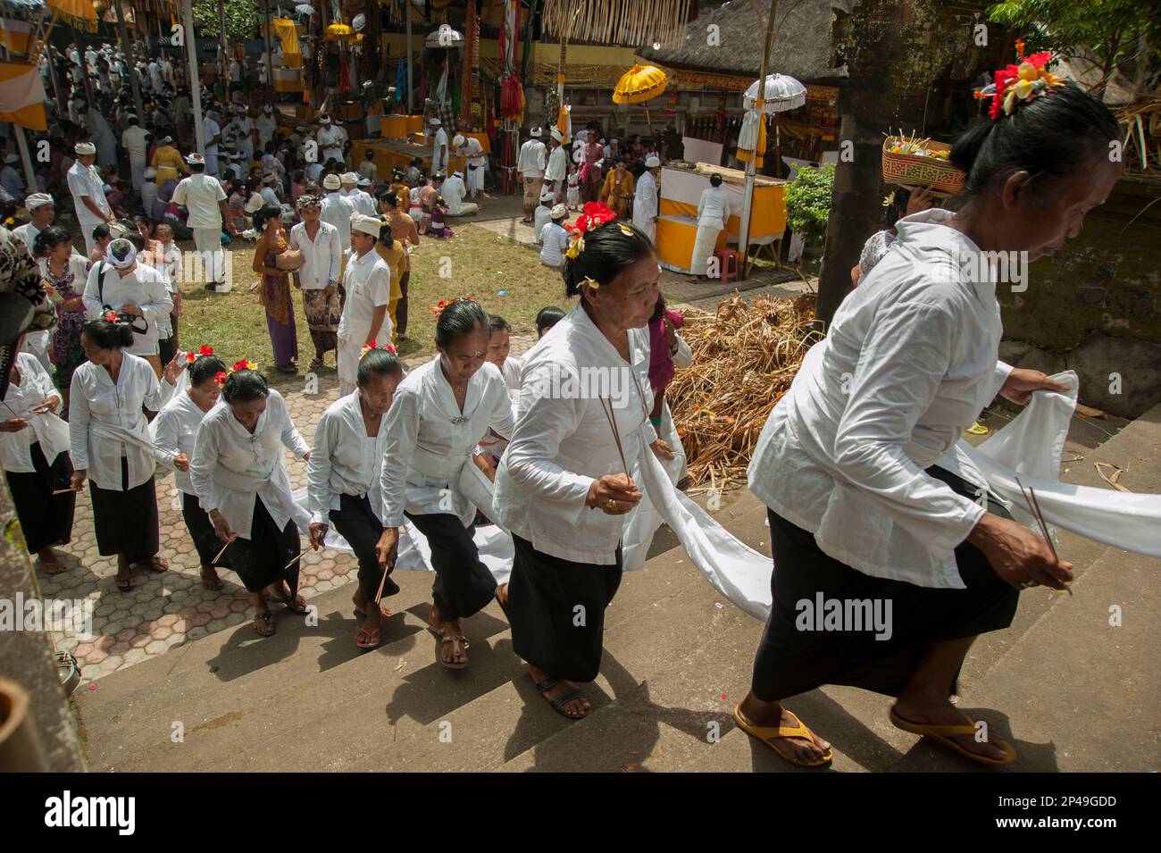 Old women (sutri) with incense in procession during Siat Sampian ...