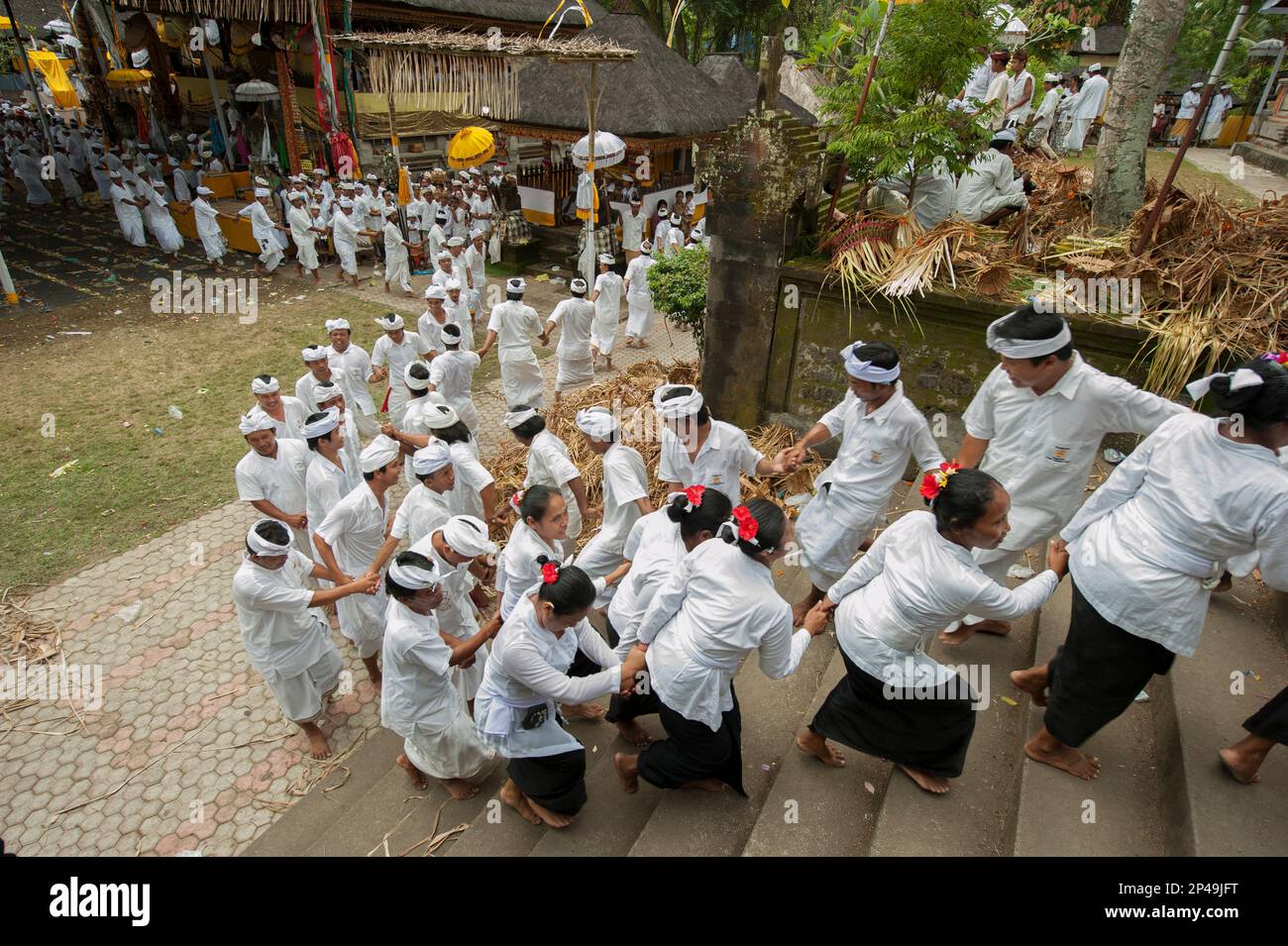 Men and old women (sutri) holding hands in procession during Siat ...