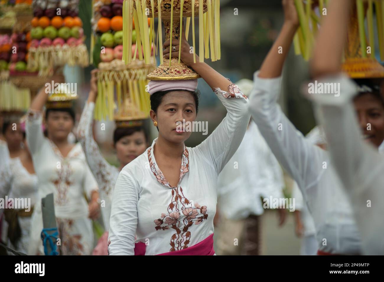 Women in procession carrying offerings during Mepeed ceremony, Siat ...