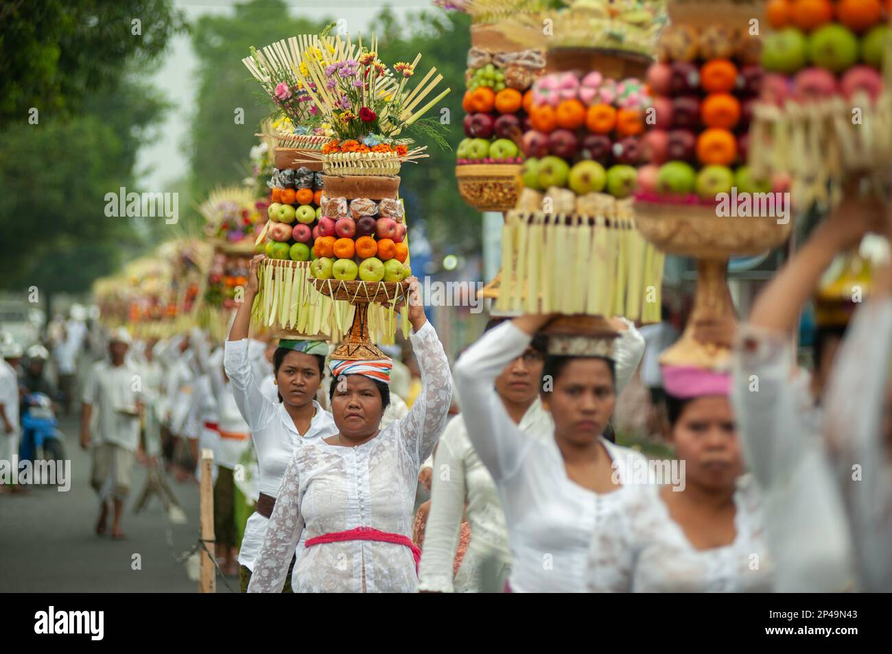 Women in procession carrying offerings during Mepeed ceremony, Siat ...