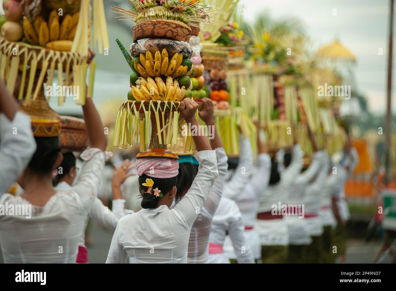Women in procession carrying offerings during Mepeed ceremony, Siat ...