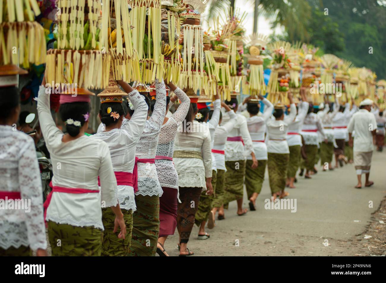 Women in procession carrying offerings during Mepeed ceremony, Siat ...