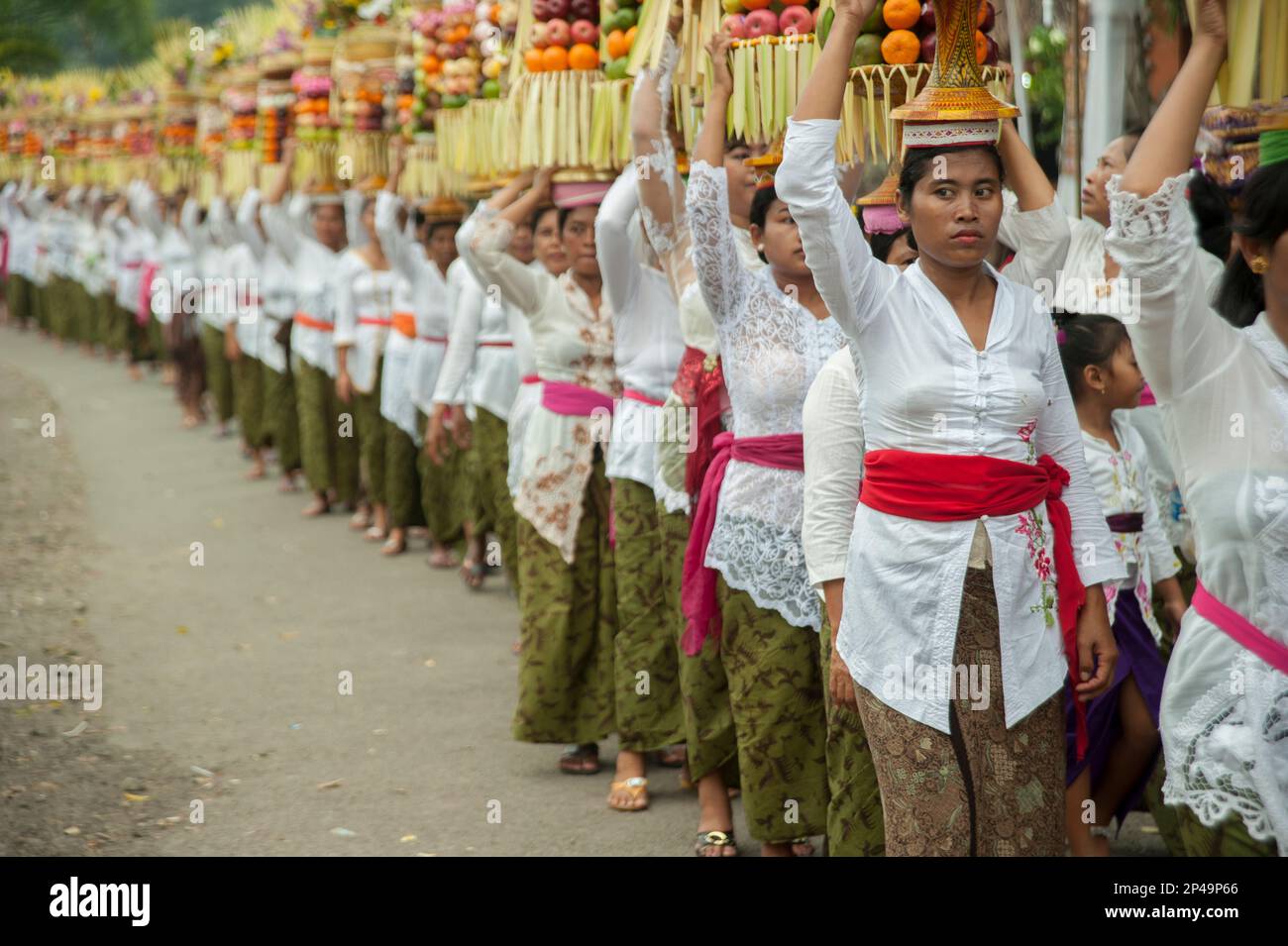 Women in procession carrying offerings during Mepeed ceremony, Siat ...