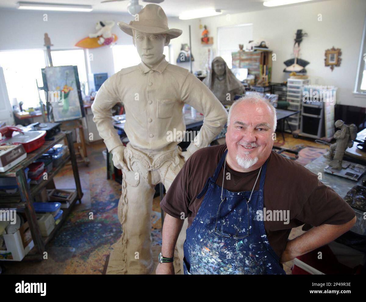 In this July 30, 2014 photo, artist Jerry Werner stands with his ...