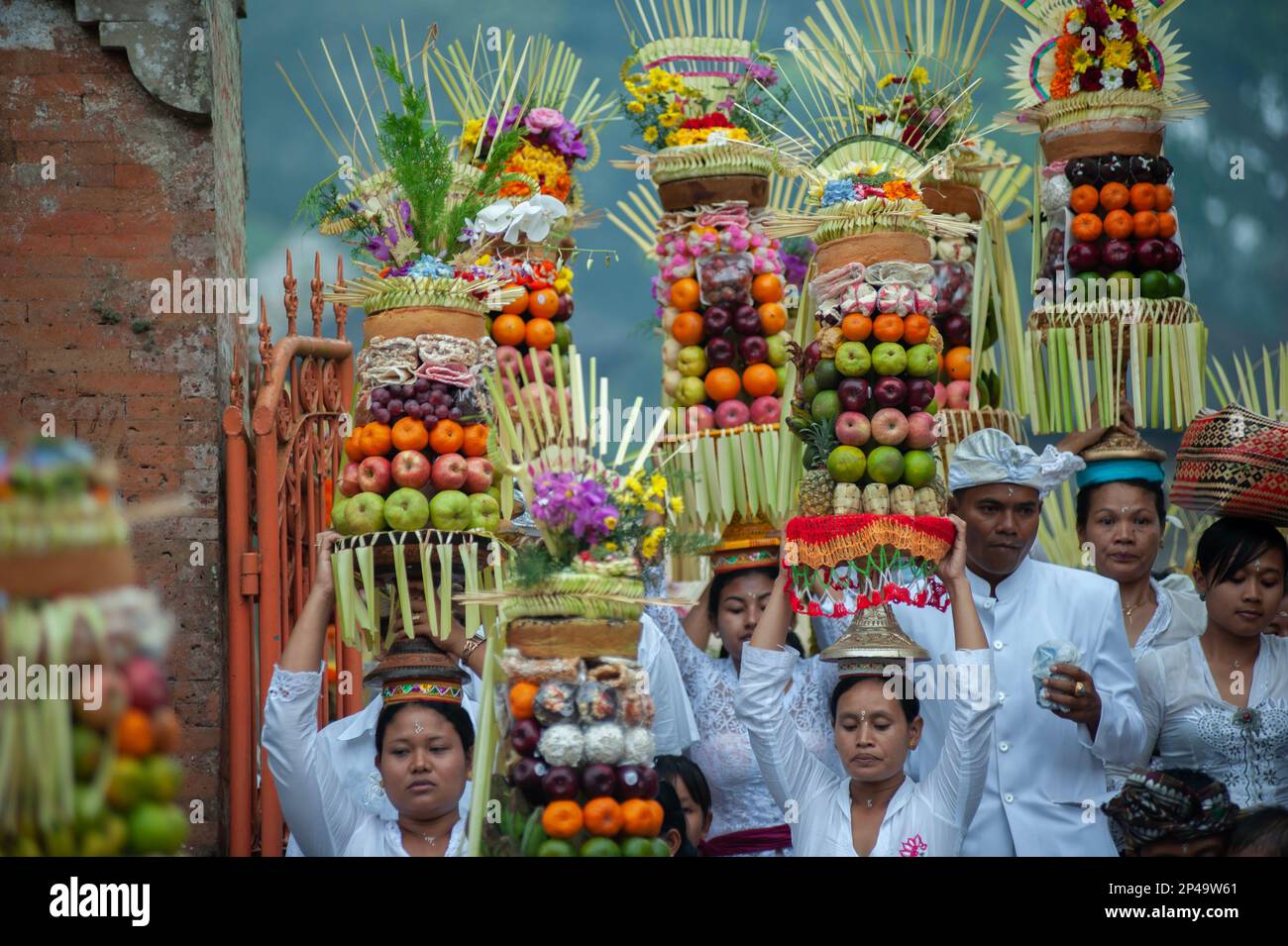 Women in procession carrying offerings during Mepeed ceremony, Siat ...