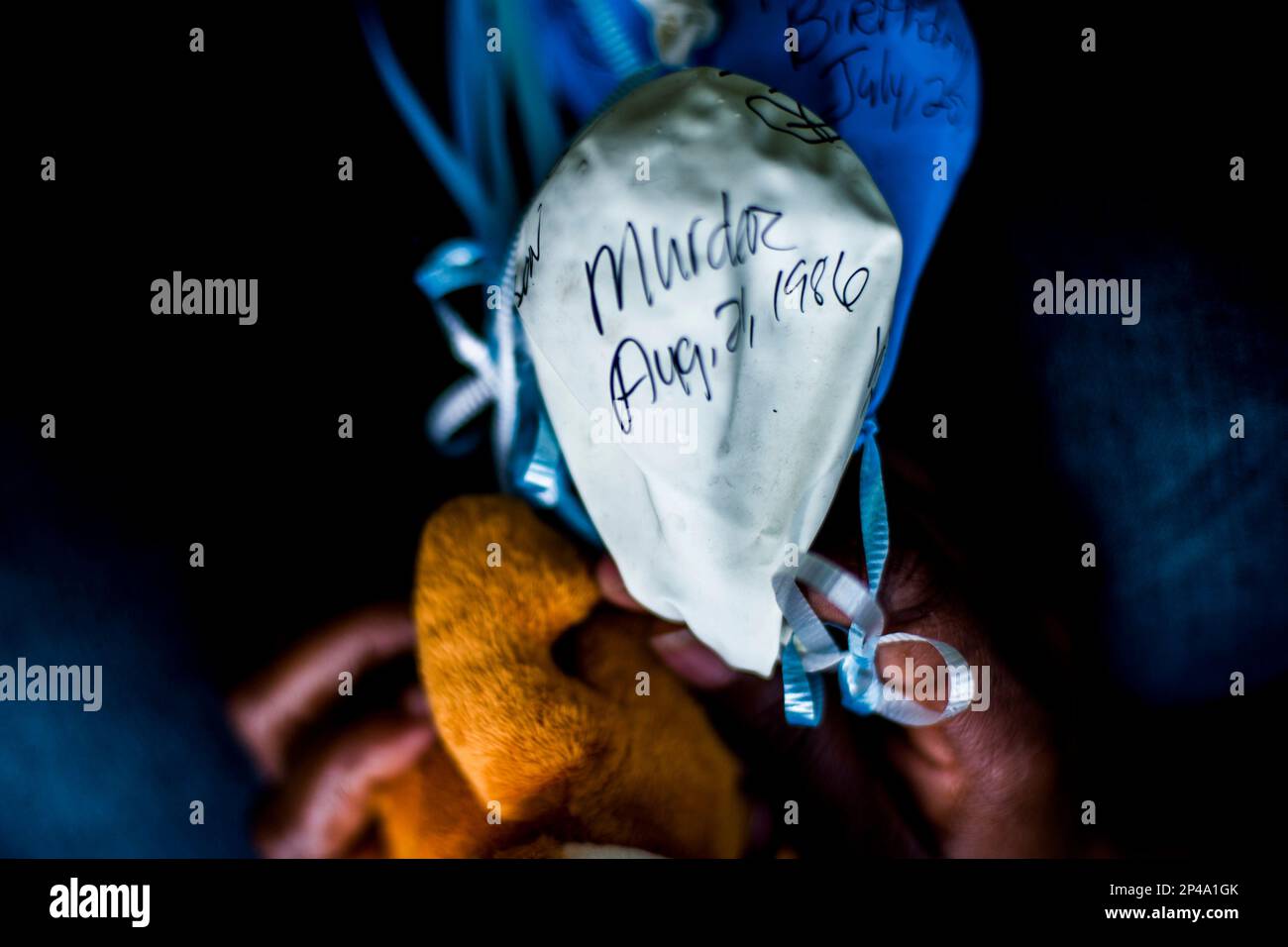 In this July 29, 2014 photo, Melinda Parker, 48, holds a teddy bear and ...
