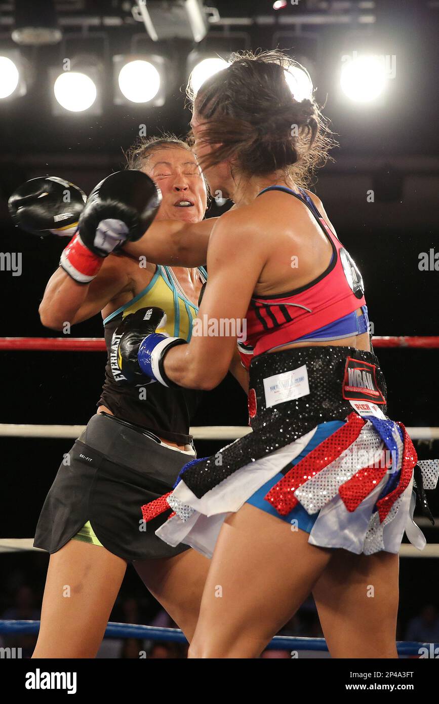 Noemi "NoNo" Bosques (red) and Yolaine LinDeLauf fight during a ...