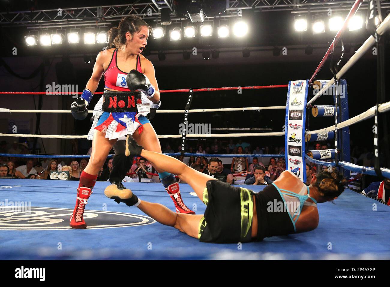 Noemi "NoNo" Bosques (red) and Yolaine LinDeLauf fight during a ...