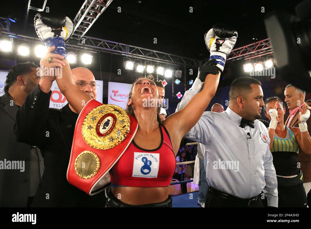 Noemi "NoNo" Bosques (red) and Yolaine LinDeLauf fight during a ...