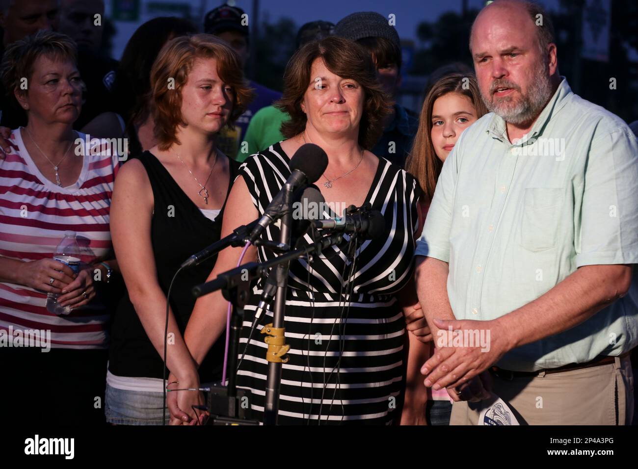 Michelle Patrick stands with her daughter's Erin, 19, and Amy, 14, as ...