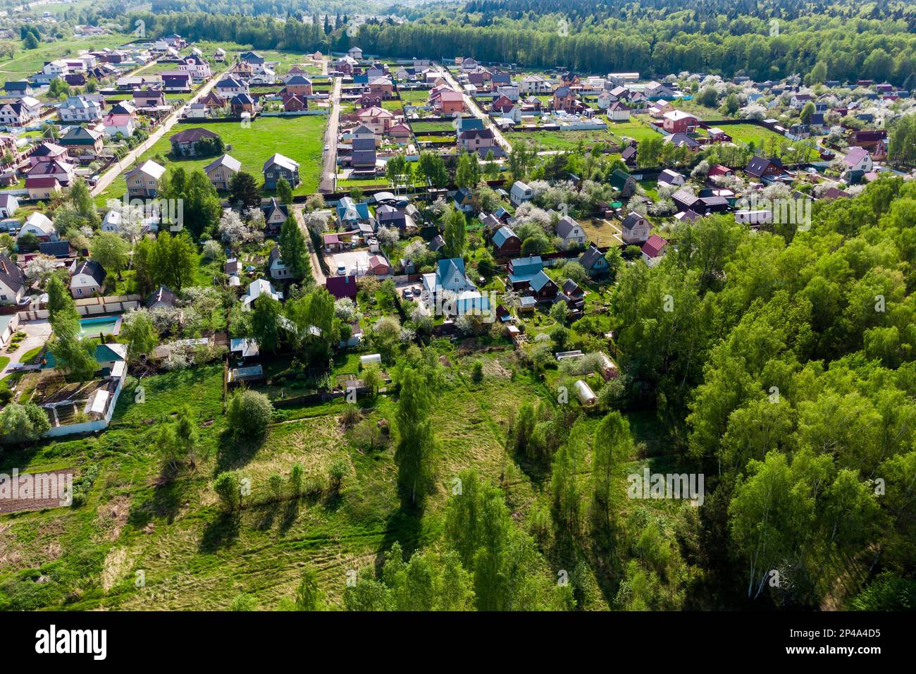 Country buildings surrounded by green nature from a bird's eye view ...