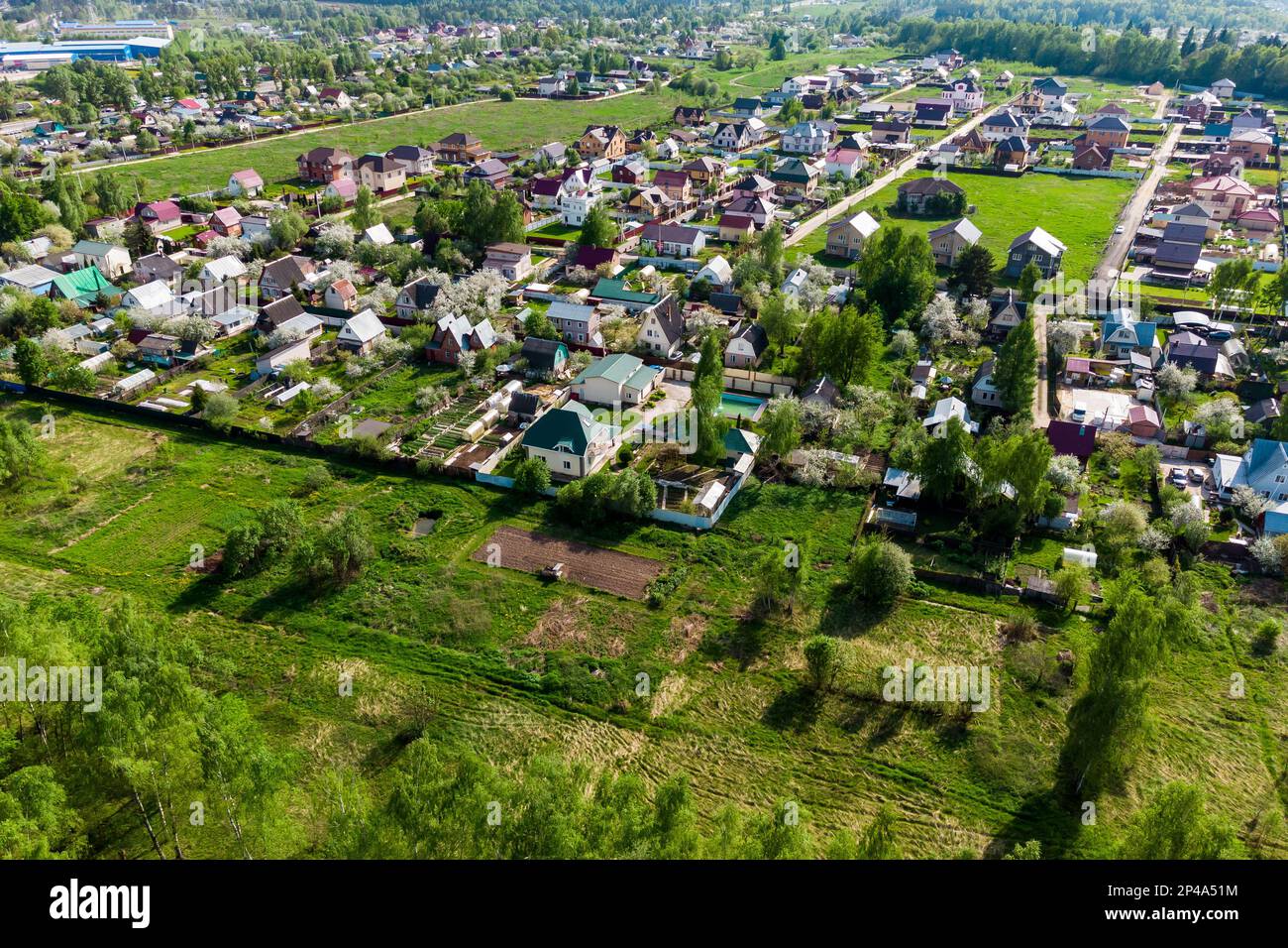 Country buildings surrounded by green nature from a bird's eye view ...