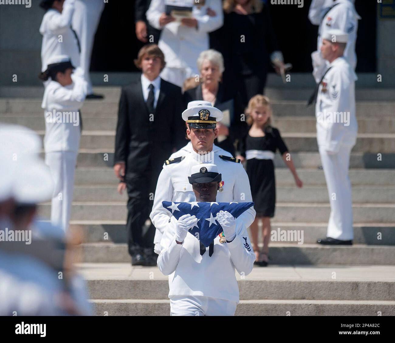 The family of Adm. Charles R. Larson follows his remains out of the ...