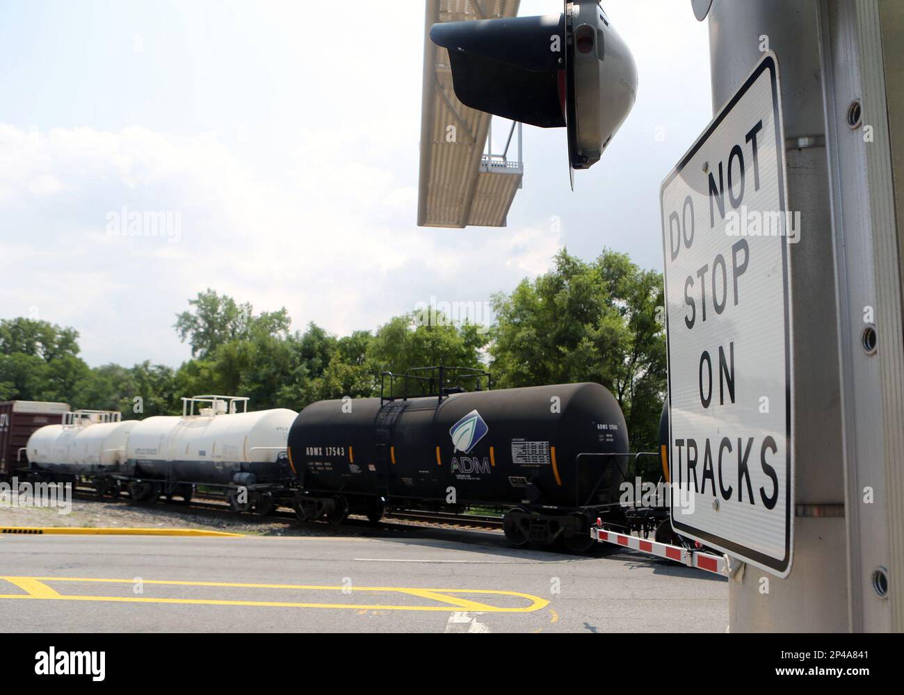 A freight train crosses tracks in Hammond, Ind. Indiana state law says ...