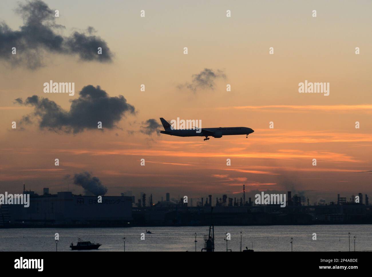 A JAL airplane landing at Haneda International Airport in Tokyo, Japan ...