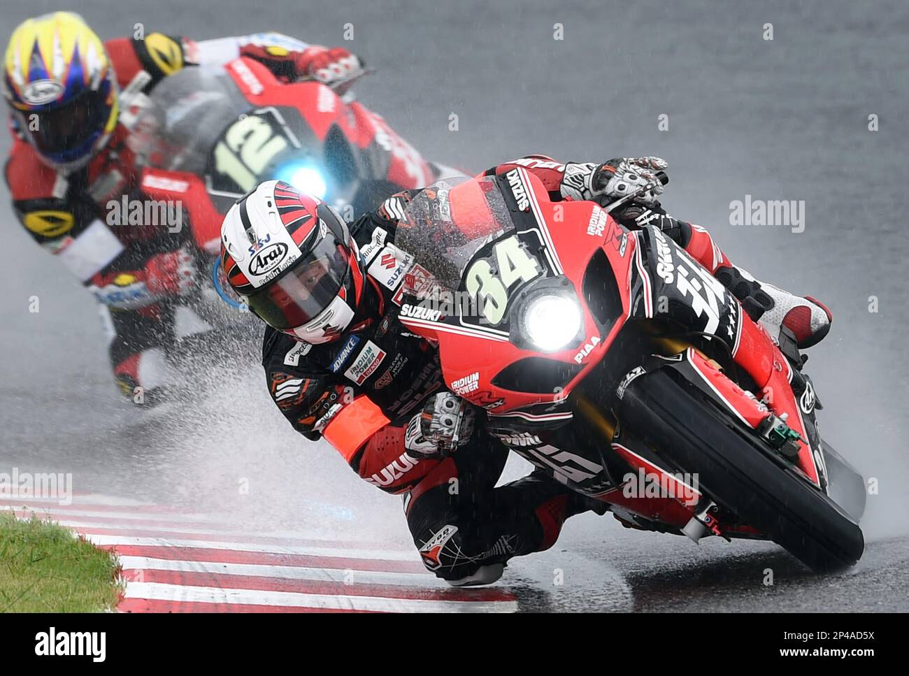 Japanese Takuya Tsuda (R) of Yoshimura Suzuki Shell Advance Team ...
