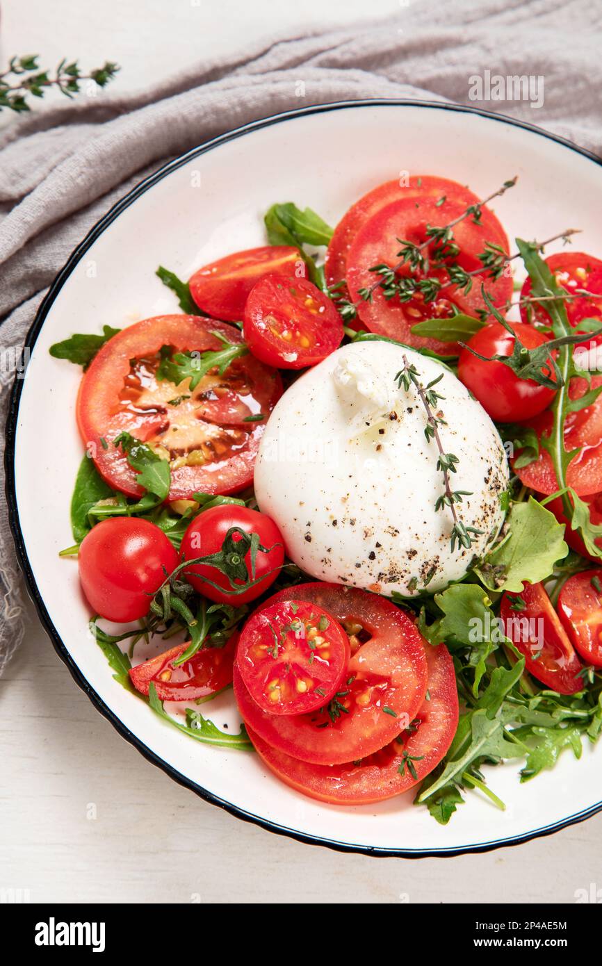 Tomato, basil, mozzarella. Caprese salad with olive oil. Top view ...