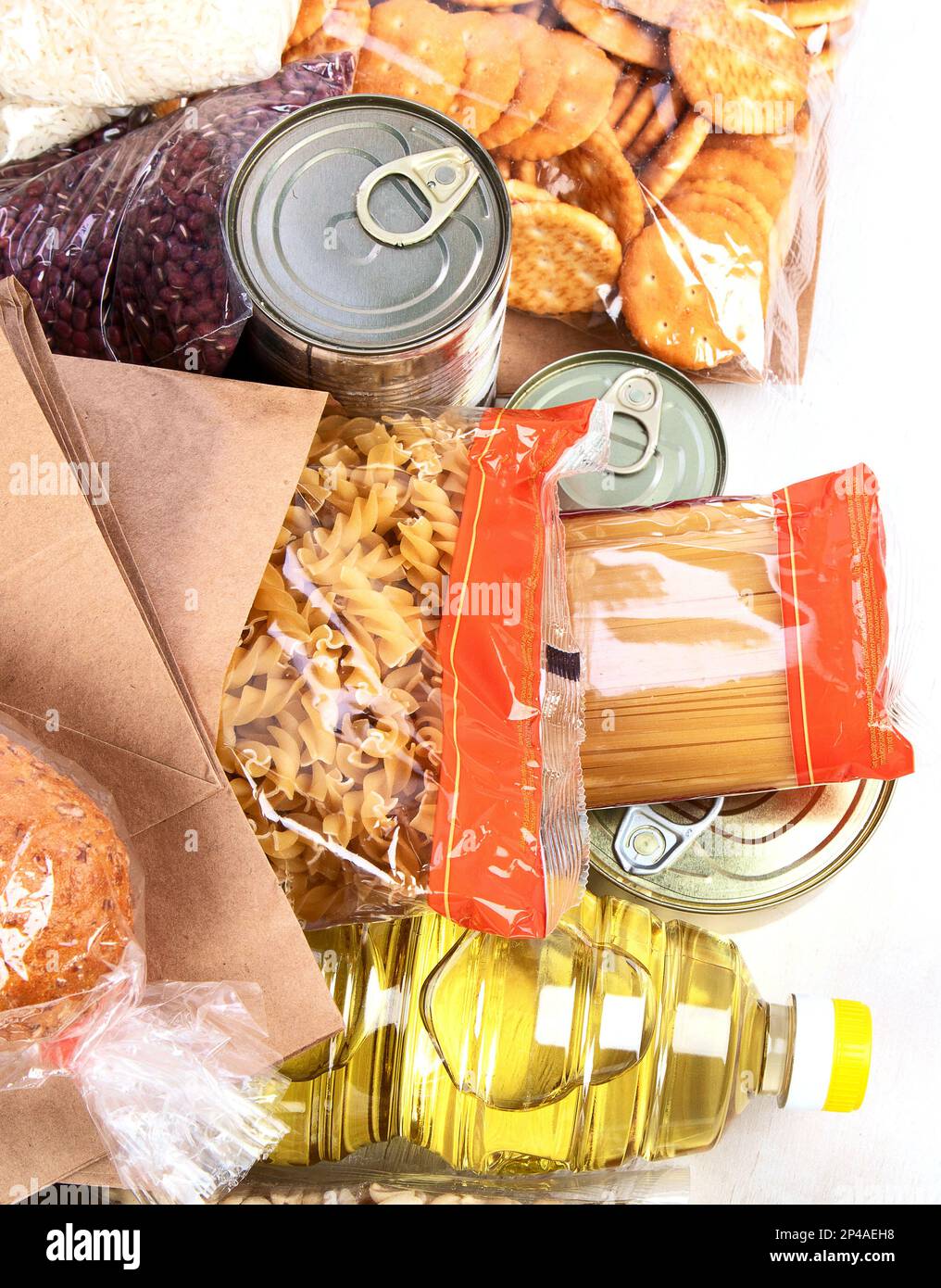 Food donations with pasta, rice, oil, peanut butter, canned food, jam ...
