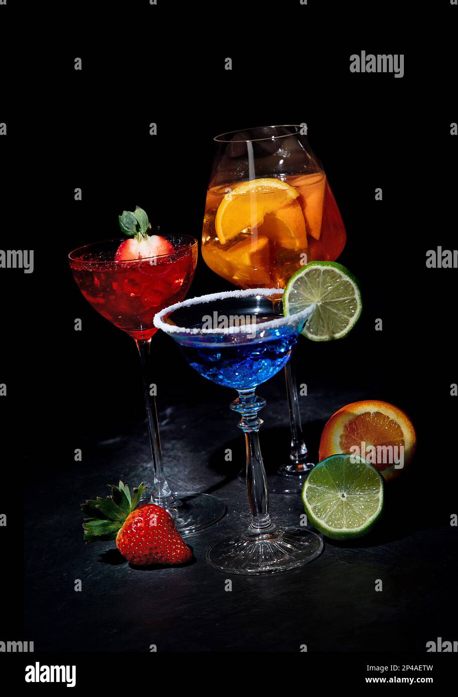 Set of various colorful cocktails on black background. Classic long ...