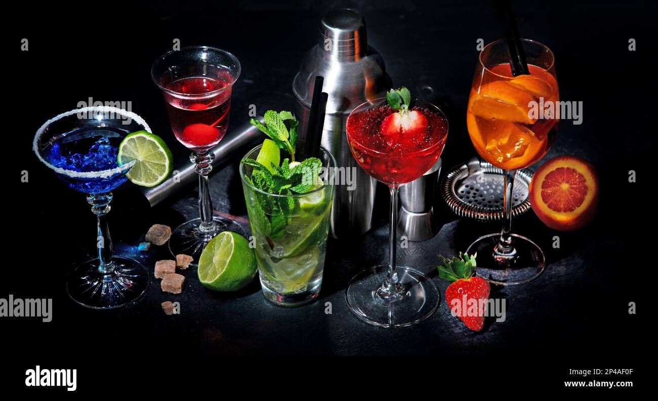 Set of various colorful cocktails on black background. Classic long ...