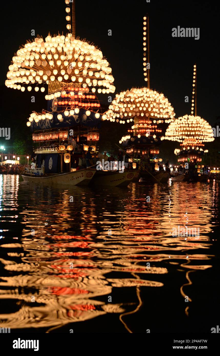 Boats decorated with Noh-dolls and lanterns float on the Tenno river in ...
