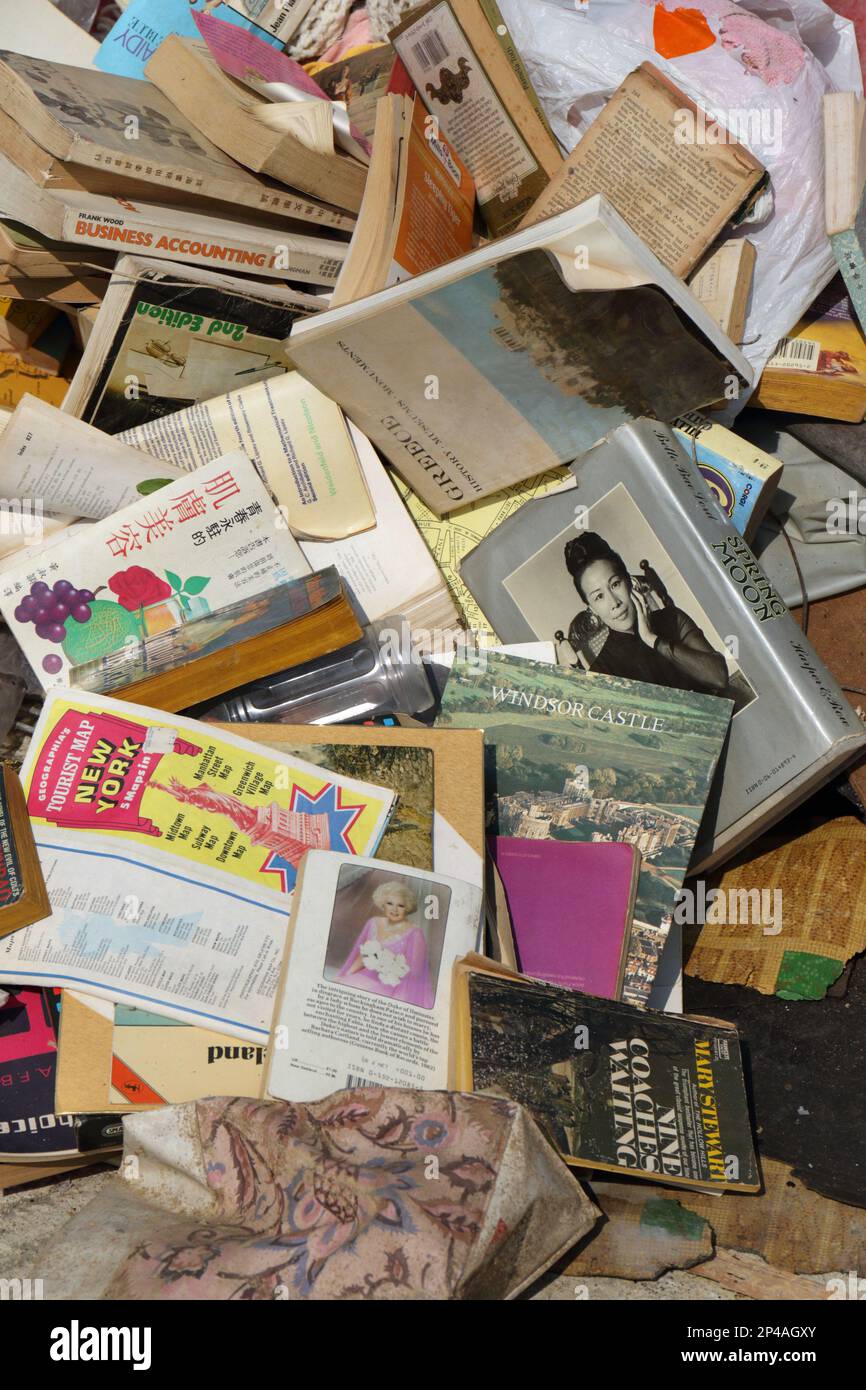 Books , from a cleared-out house, discarded at a rubbish collection ...