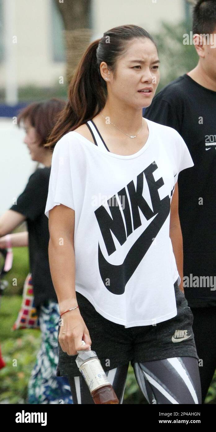 Chinese tennis star Li Na is pictured as she arrives for the unveiling ...