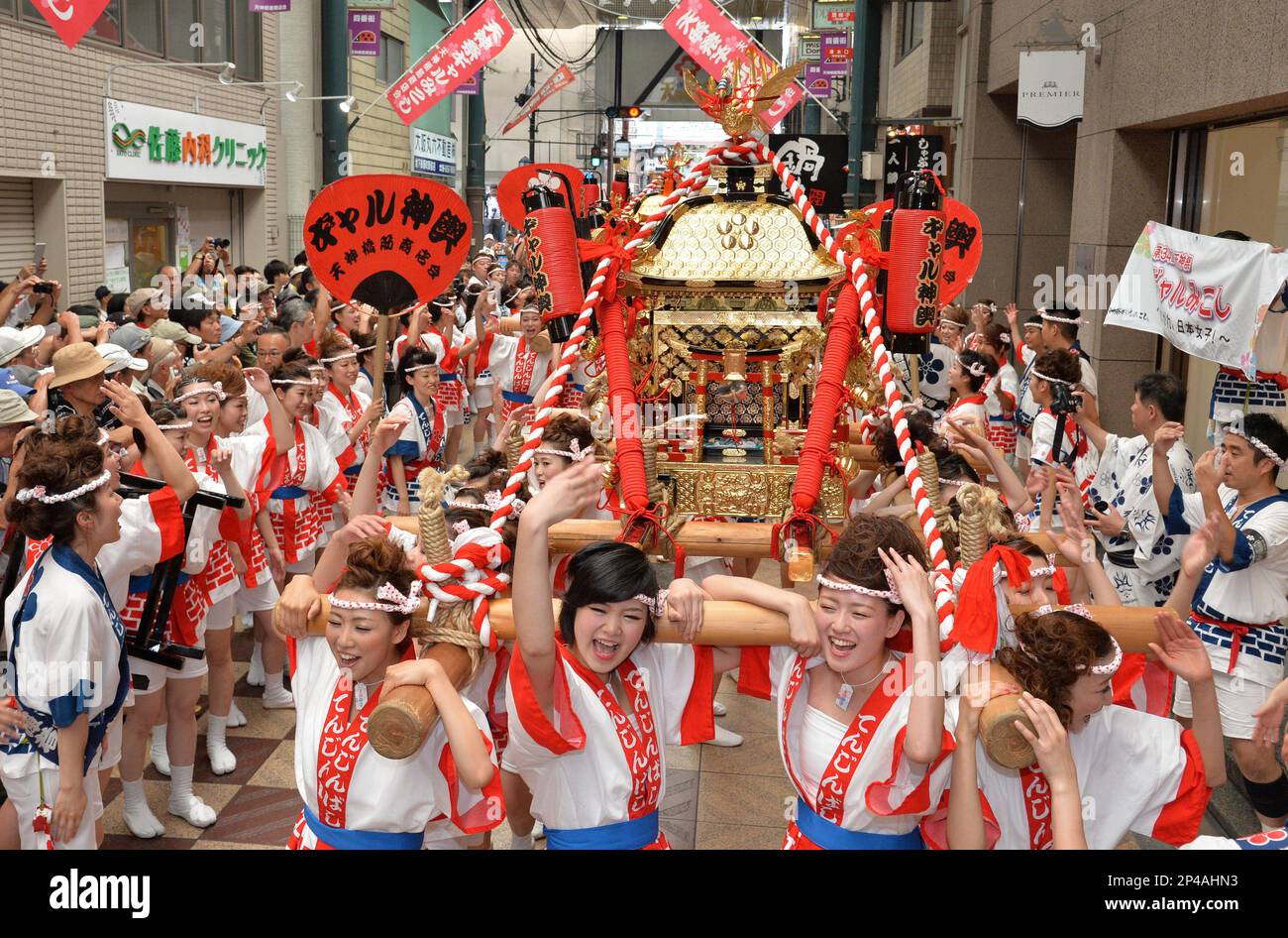 Girls carry a portable shrine during the Gal Mikoshi Parade of the ...