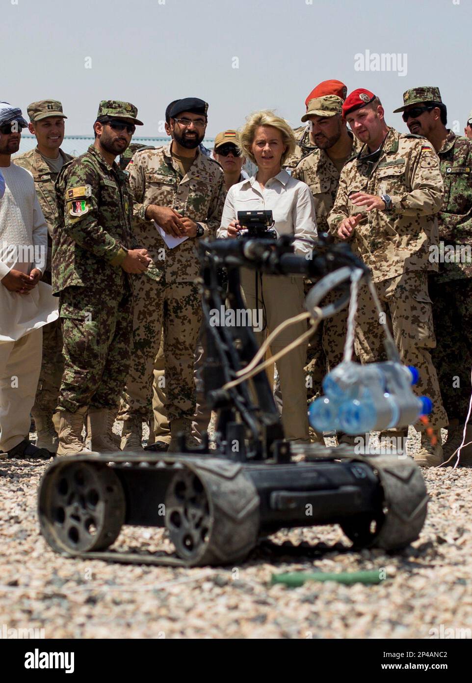 German Defense Minister Ursula von der Leyen, center, drives a radio ...