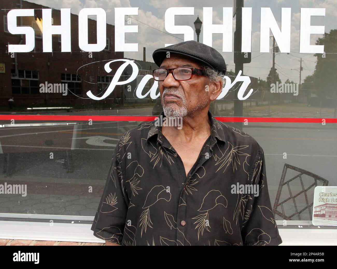 In this May 6, 2014 photo, shoe shine legend Curtis Phillips stands ...