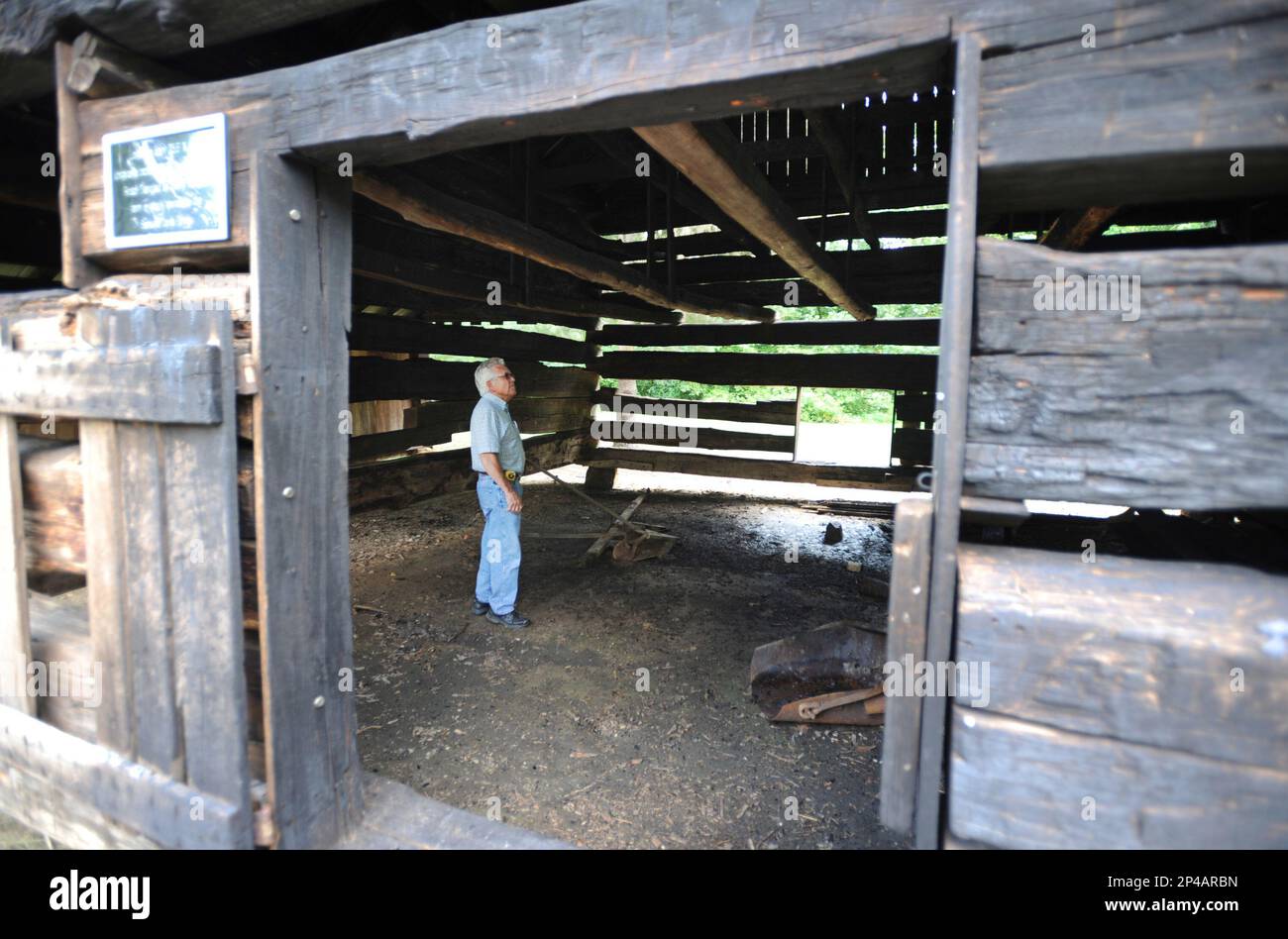 Ward Pedley Sr. stands inside the historic log barn on Monday, Juky 21 ...