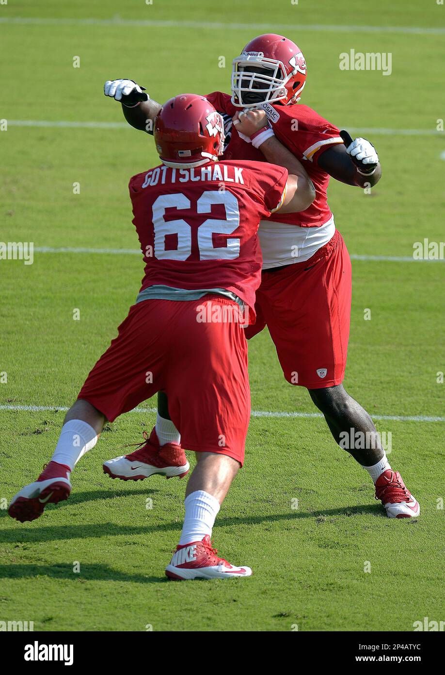 Kansas City Chiefs NFL football center Ben Gottschalk pushes guard Zach ...