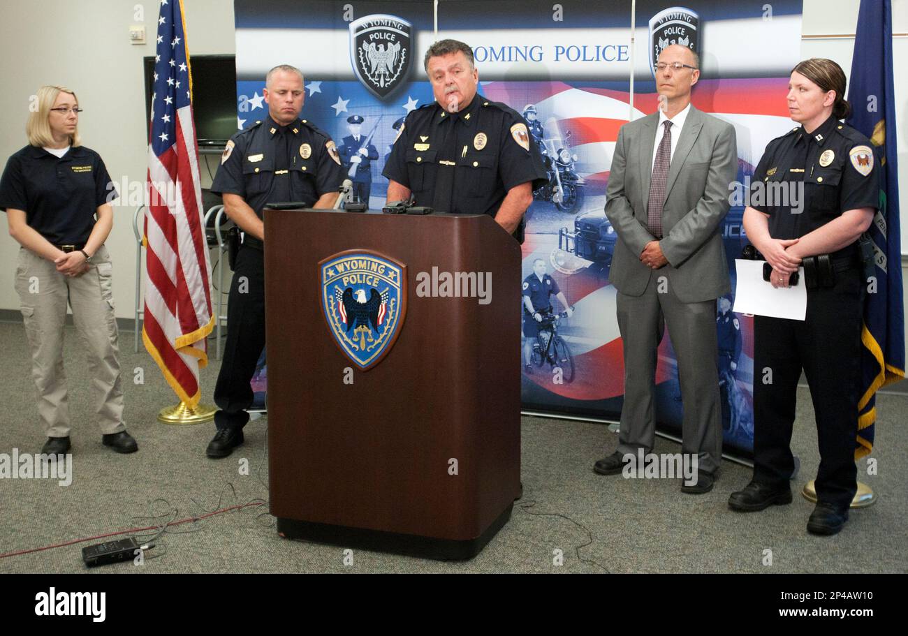 Wyoming police Chief James Carmody, middle, holds a press conference ...