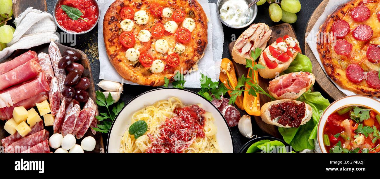 Italian food dishes on dark background. Traditional italian cuisine ...