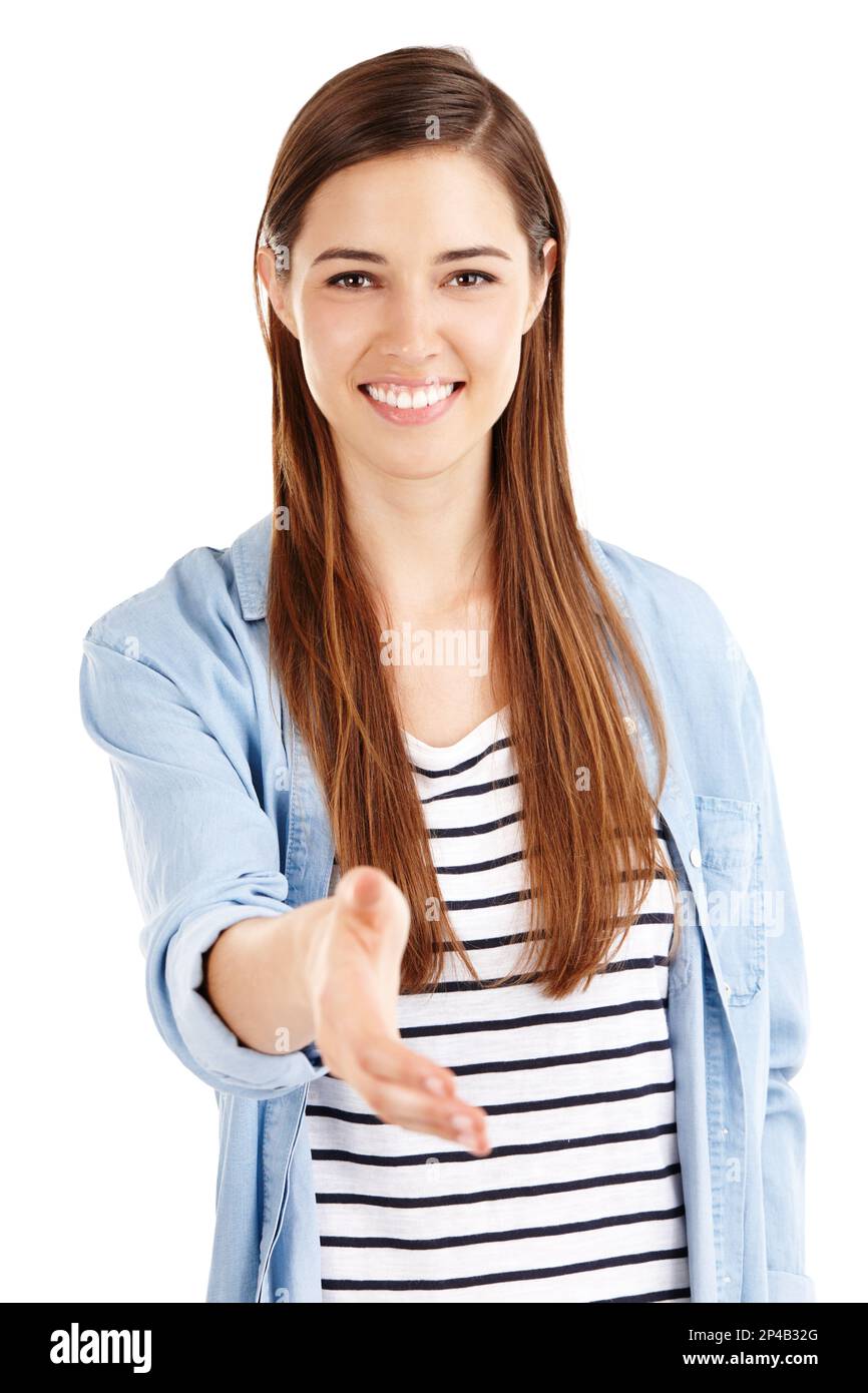 Welcome. Studio shot of a beautiful young woman extending her arm for a ...