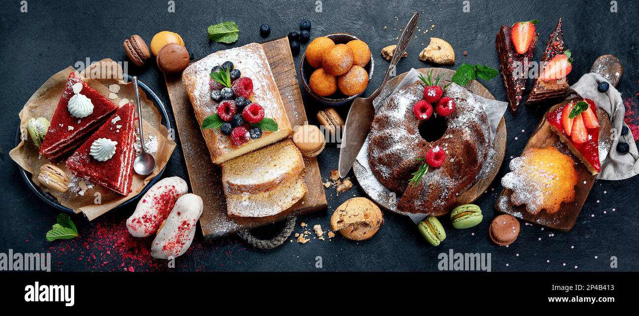 Different desserts on dark background. Delicious sweet dessert table ...