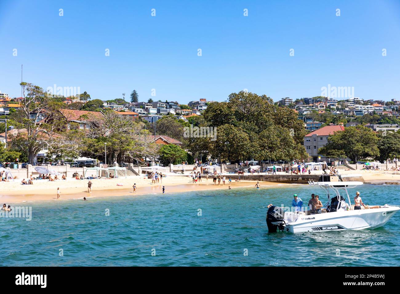 Balmoral Beach Sydney, people sunbathing and some fishing off a boat ...