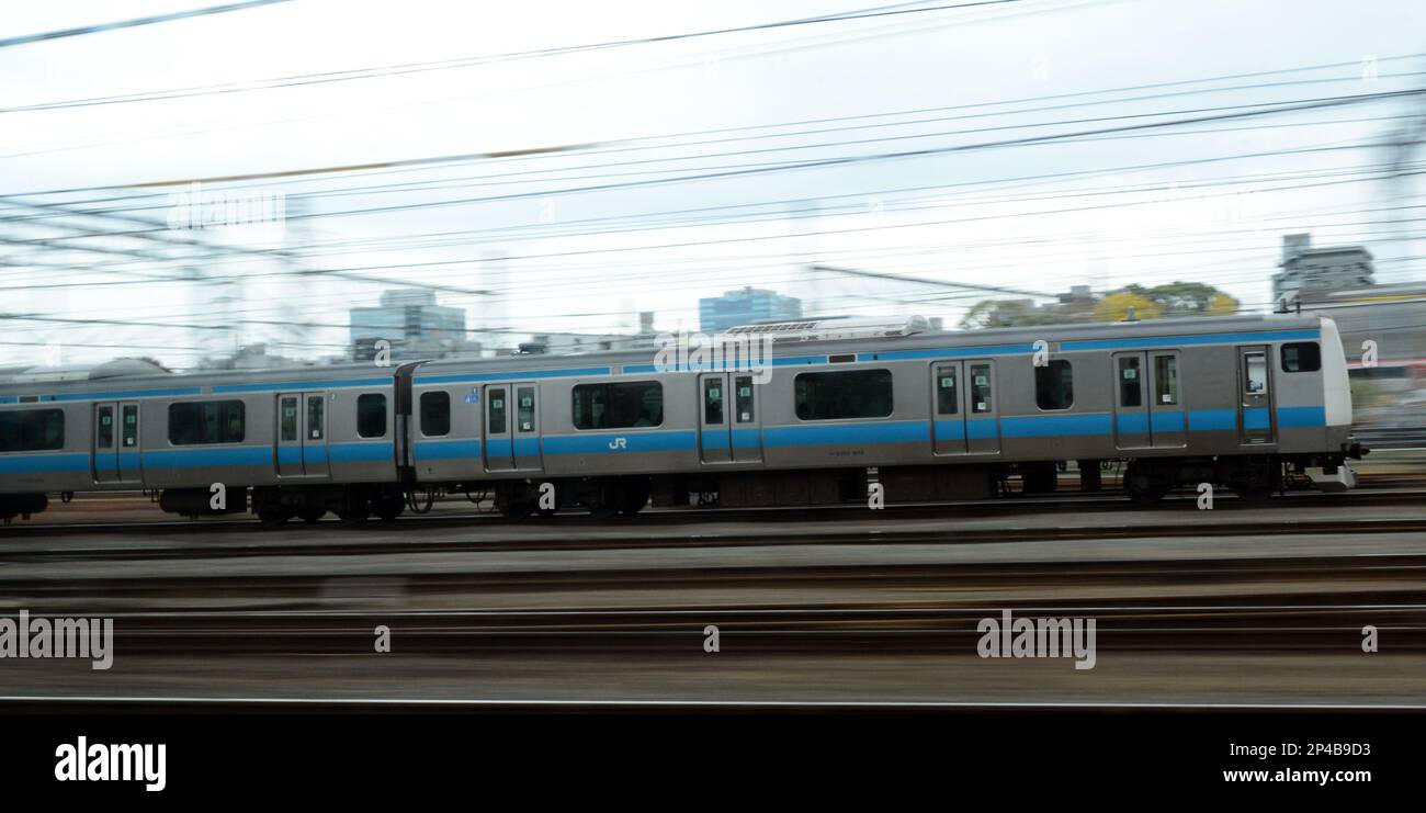 A JR local train in motion in the suburbs of Tokyo, Japan Stock Photo ...