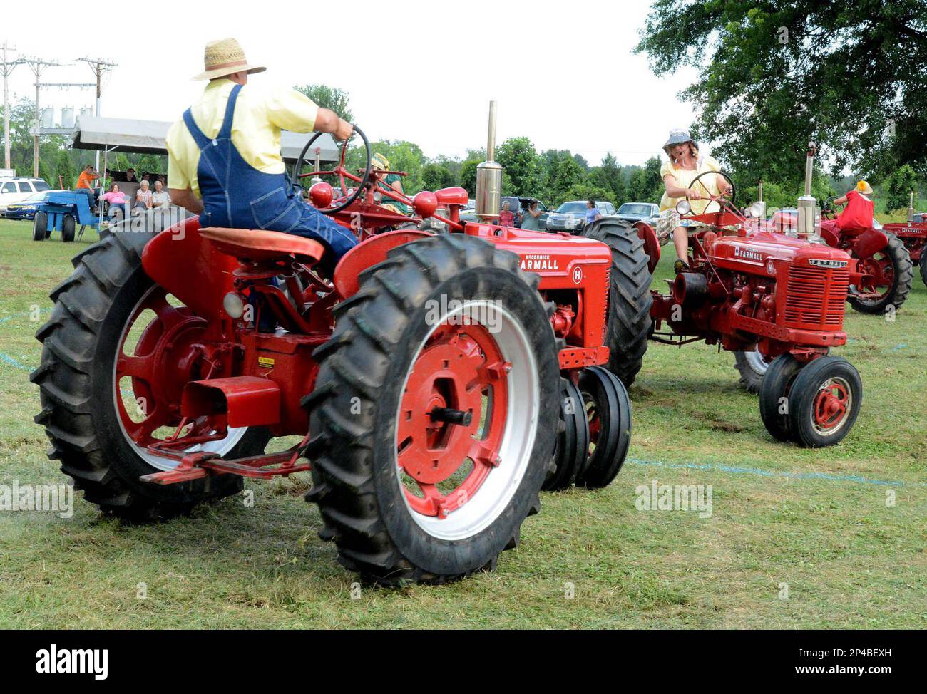 "Billy Bob", left, and "Lily Pearl Bob" maneuver the antique Farmall ...