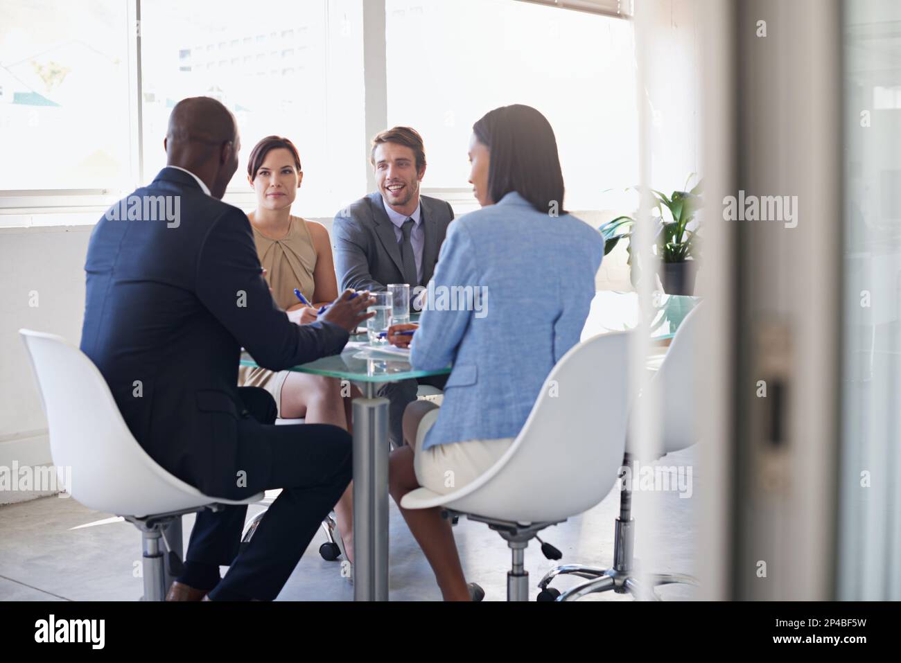 Getting down to business in the boardroom. a group of businesspeople ...