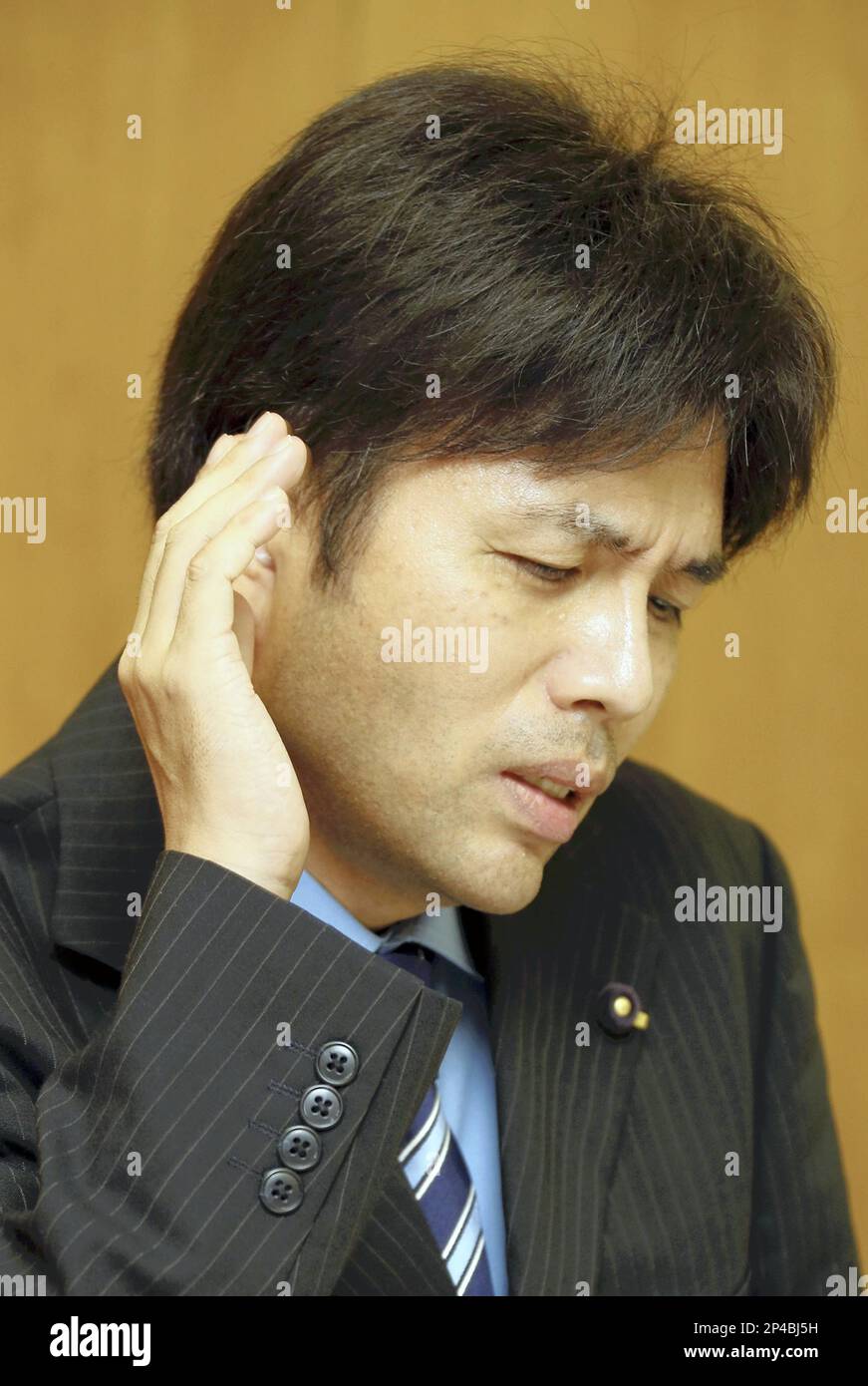 Hyogo Prefectural Assenbly member Ryutaro Nonomura listens to a question during a press ...