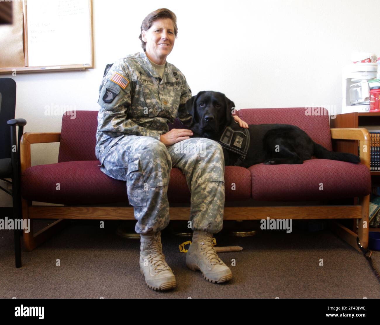 Army Chaplain (Maj.) Karen Hallett sat with her therapy dog, Zoe, a ...